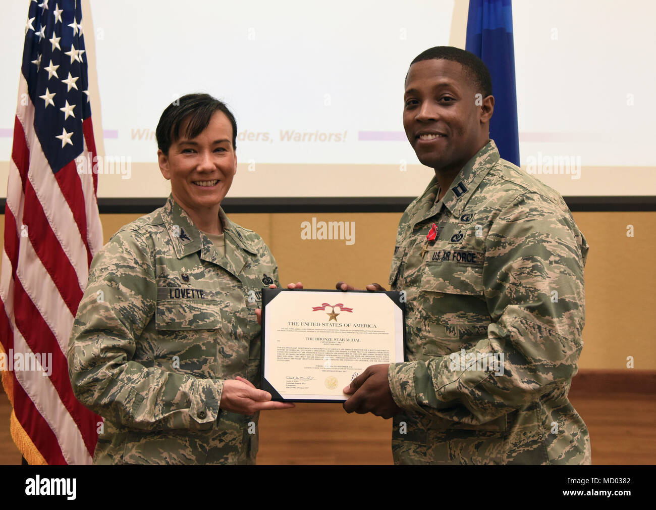 Col. Debra Lovette, 81st Training Wing commander, presents Capt. Edwin ...