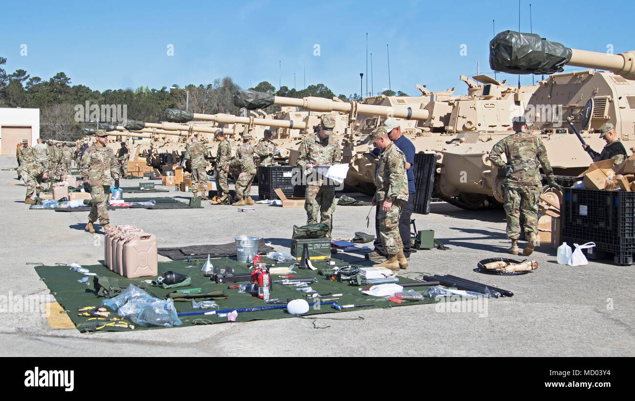 Cannon crew members from Battery B, 1st Battalion, 9th Field Artillery ...