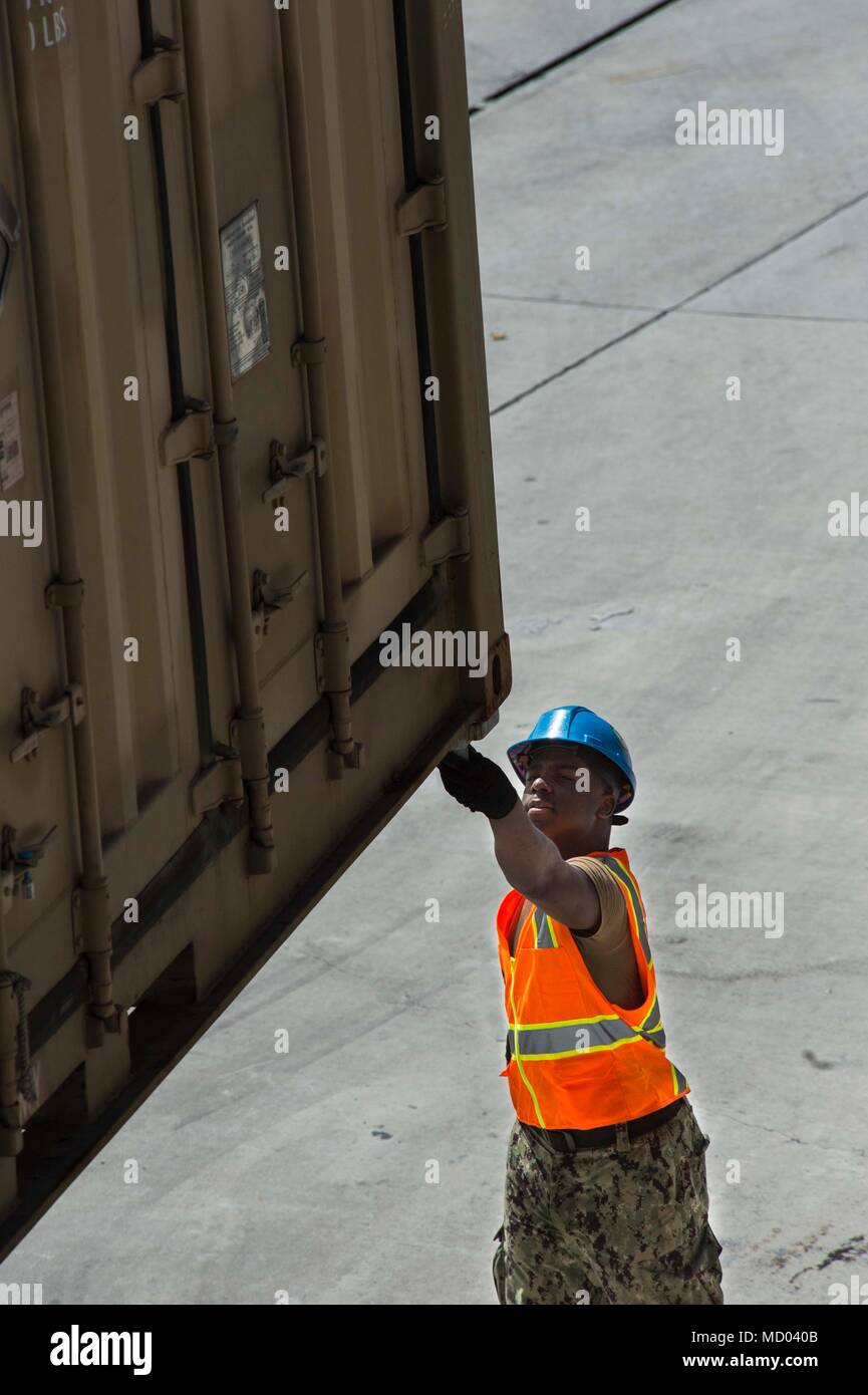 Aviation Ordnanceman Airman Mark Smith, assigned to Navy Cargo Handling ...
