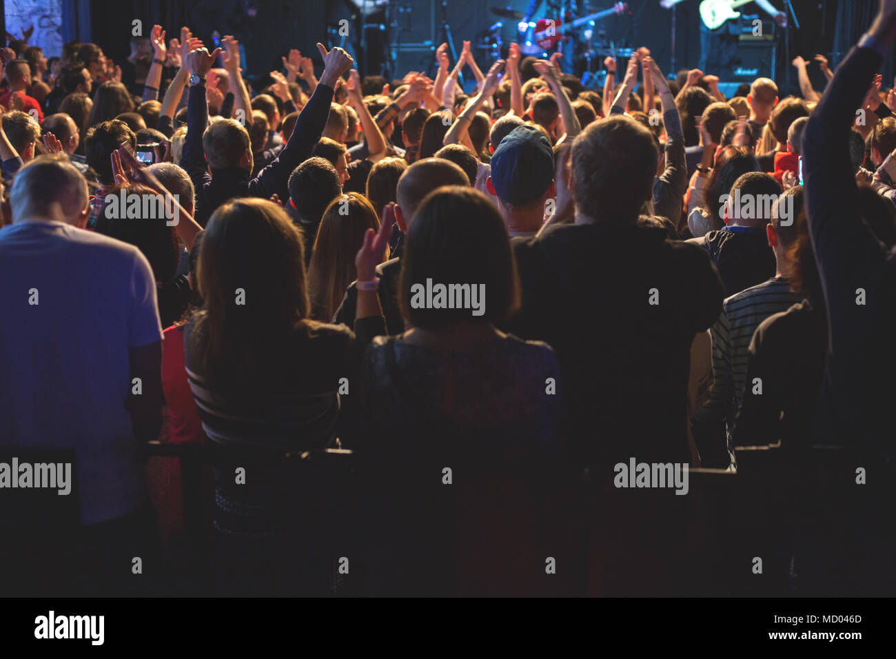 The audience watching the concert on stage Stock Photo - Alamy