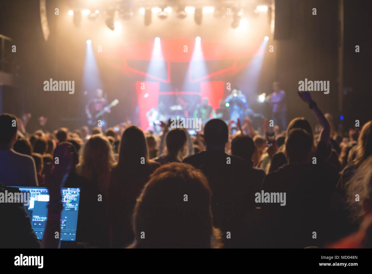 The audience watching the concert on stage Stock Photo - Alamy
