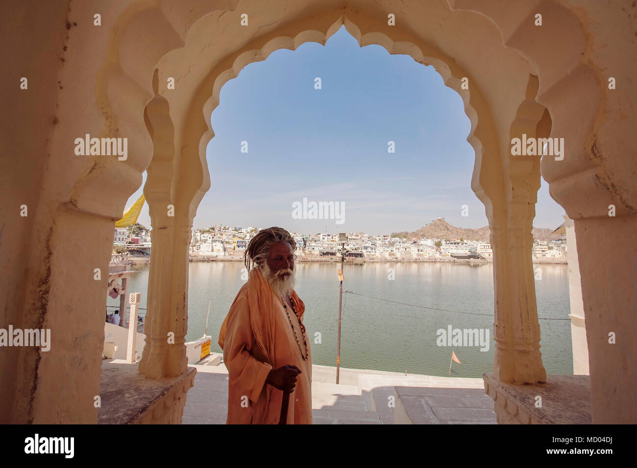 Sadhu Baba with Pushkar holy lake on the background, Pushkar city ...