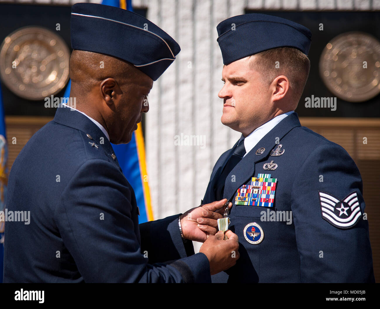 Brig. Gen. Ronald Jolly, 82nd Training Wing commander, pins the Airman ...