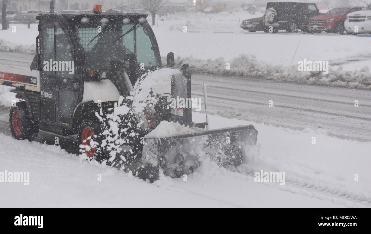 106th Rescue Wing snow removal team clear the snow off of the streets ...