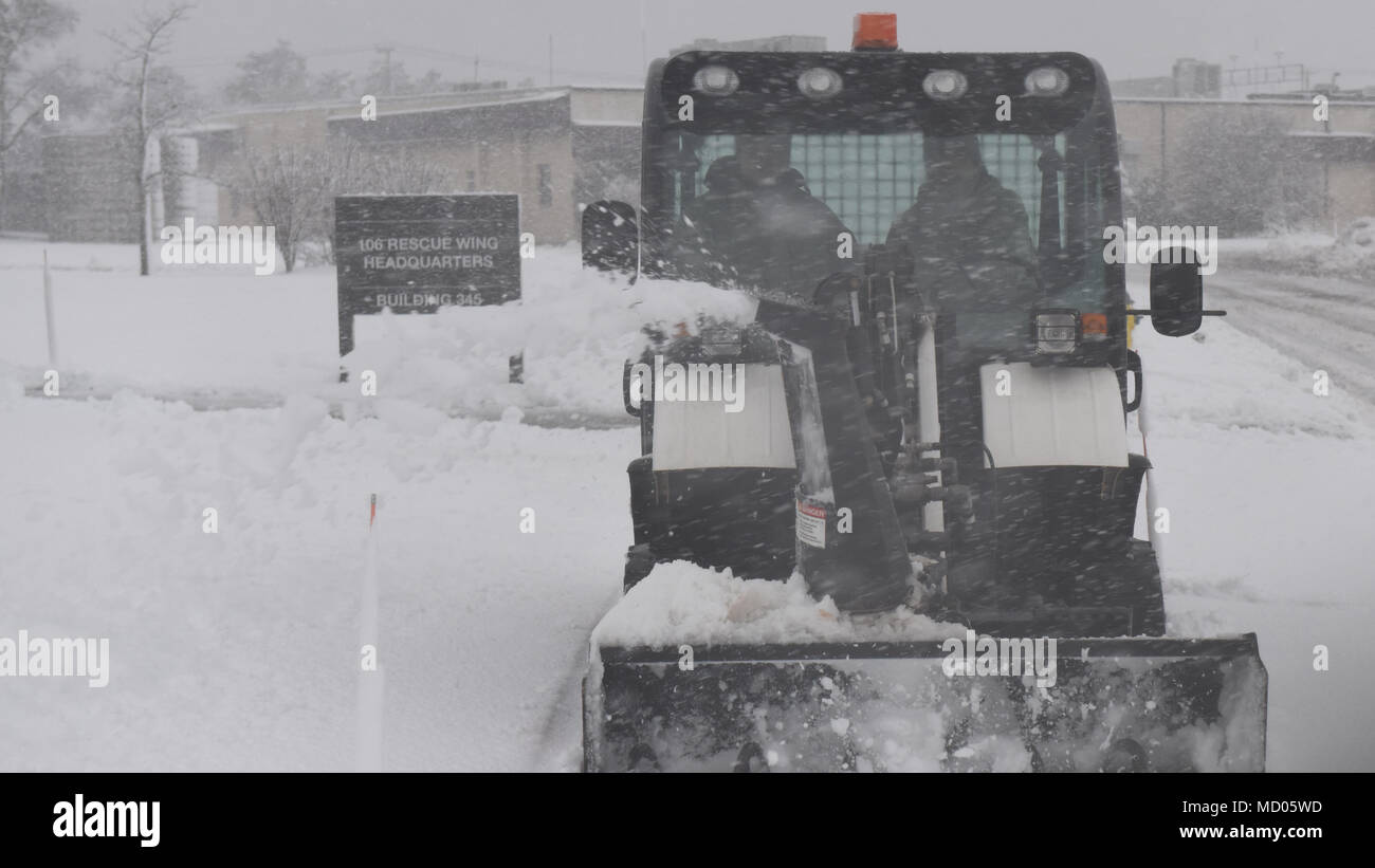 106th Rescue Wing snow removal team clear the snow off of the streets ...