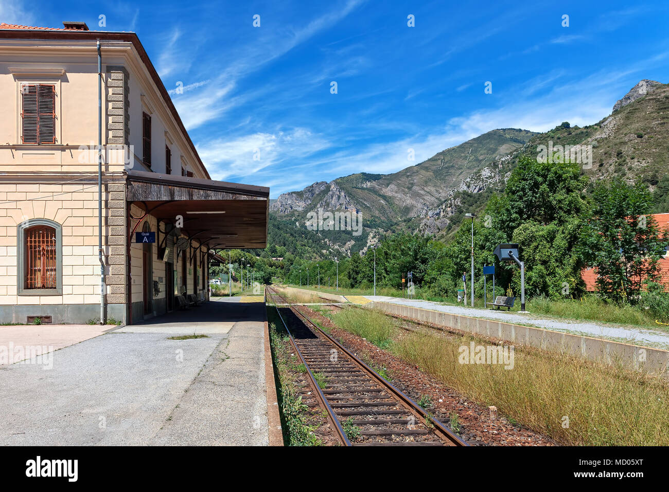 Railroad track runs along platform at local railway station of Tende ...
