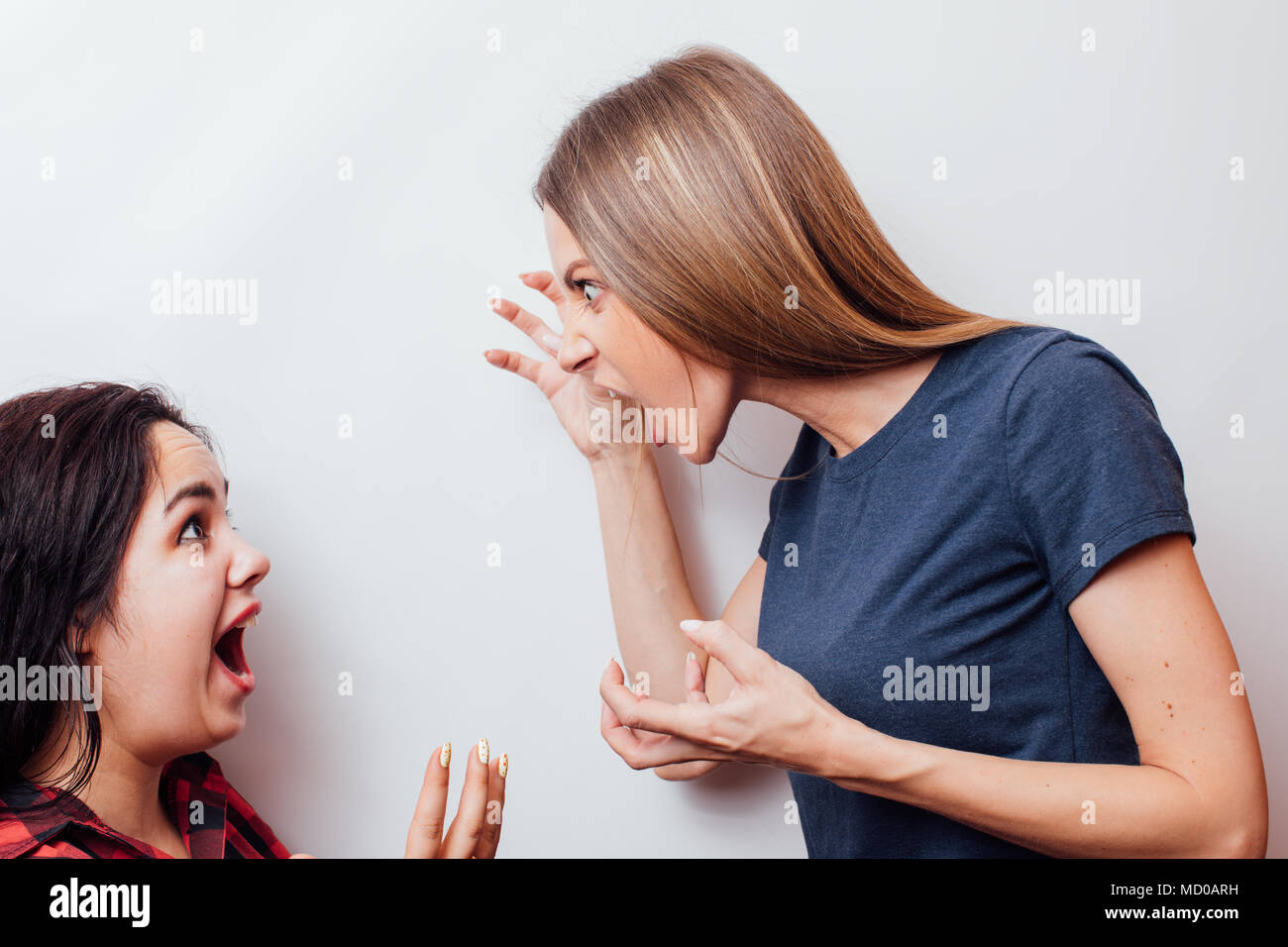 Screaming, hate, rage. Emotional, young face. Female half-length ...