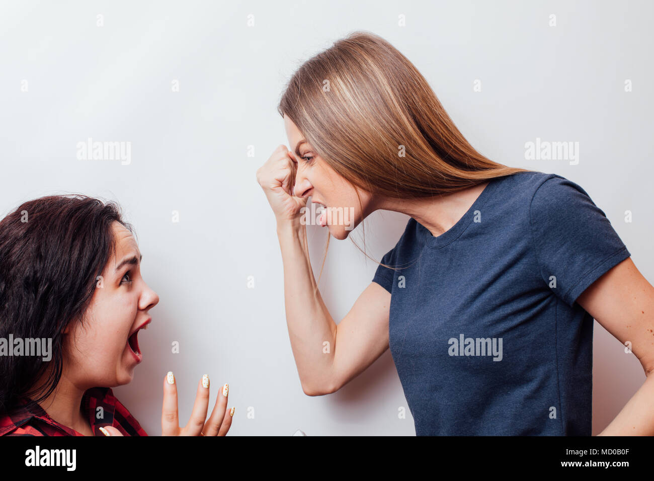 Screaming, hate, rage. Emotional, young face. Female half-length ...