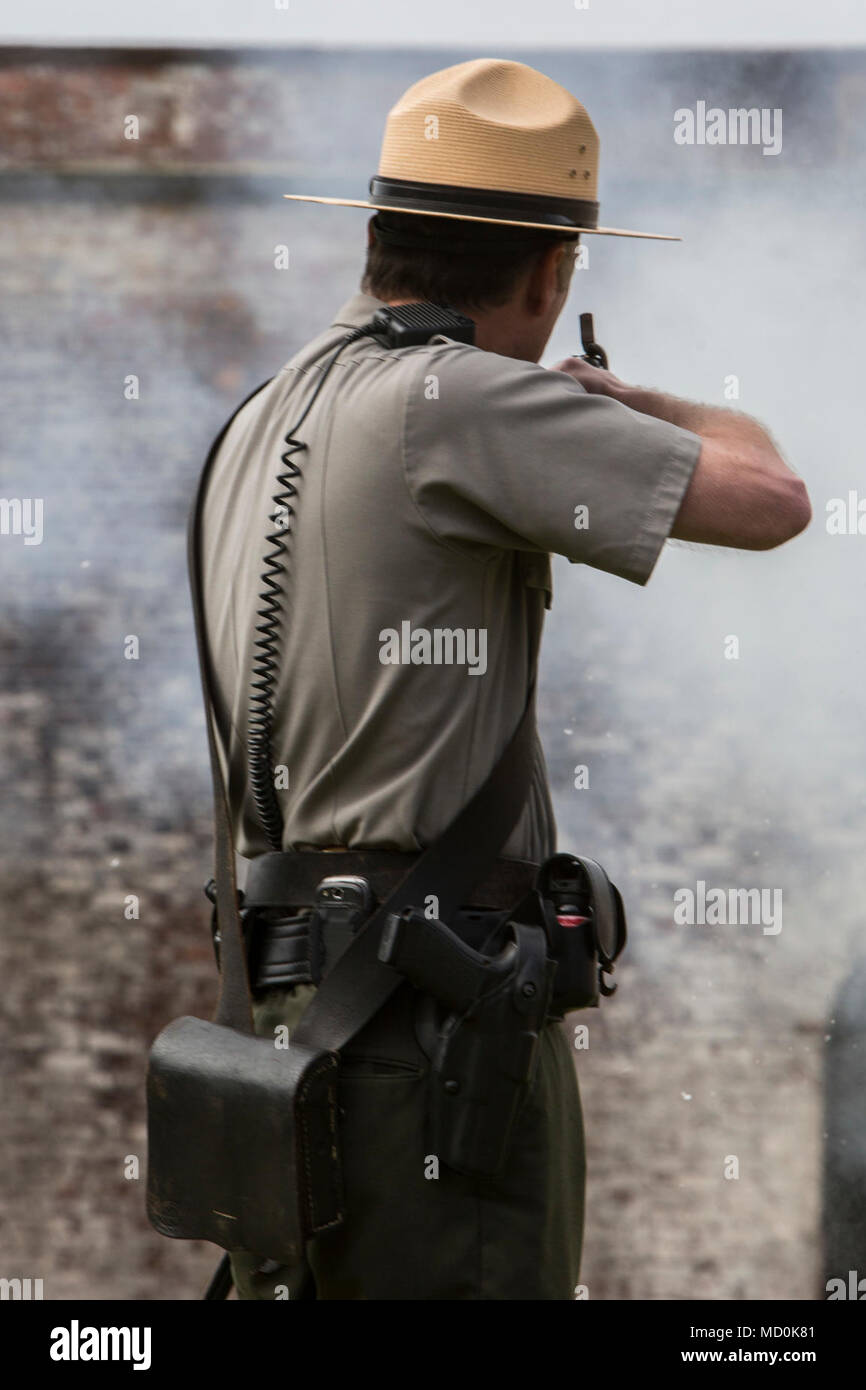 Benjamin Fleming, park ranger for Fort Macon State Park, demonstrates ...