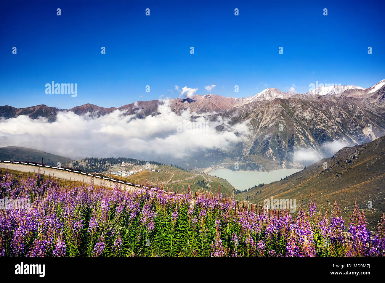 Beautiful landscape of lake and road in foggy mountains in Almaty ...