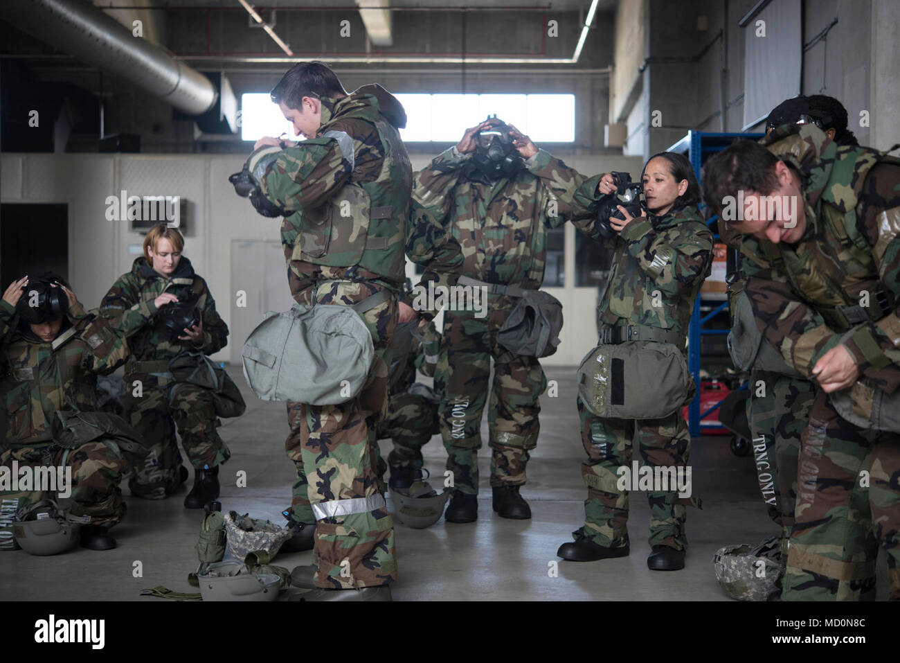 U.S. Air Force Airmen don M50 Joint Service General Protection Masks ...