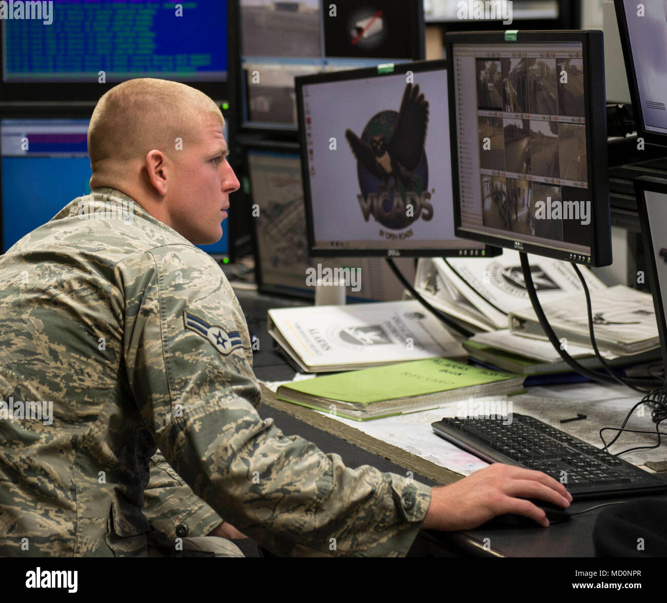 U.S. Air Force Airman 1st Class Colin Layman works as an alarm monitor ...