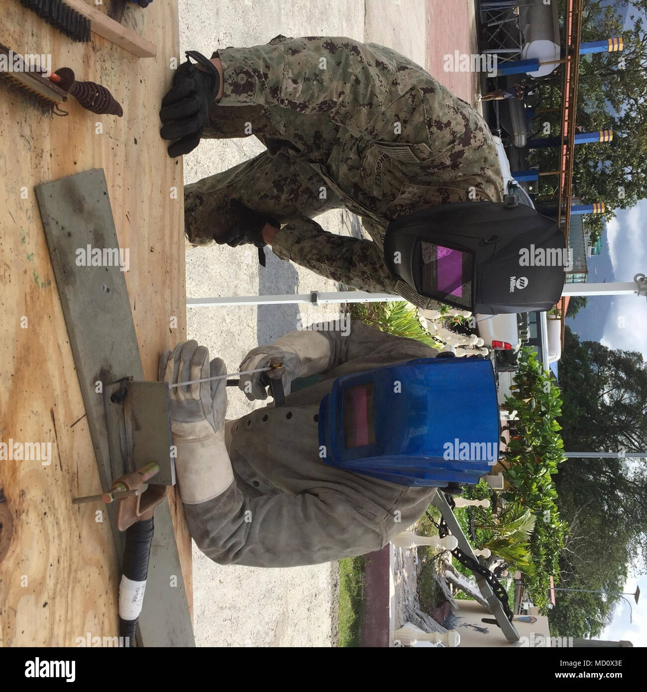 U.S. Navy Steelworker 3rd Class Brian Brookes, assigned to Naval Mobile ...