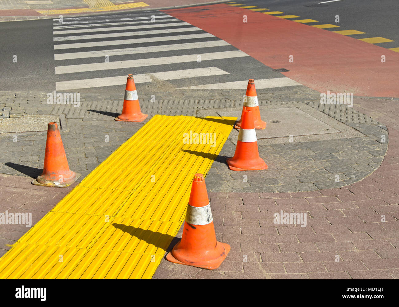 Traffic cones next to a zebra crossing Stock Photo - Alamy