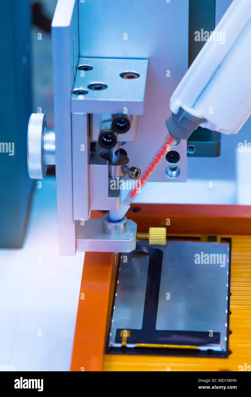 Robot holding glue syringe Injection Stock Photo - Alamy