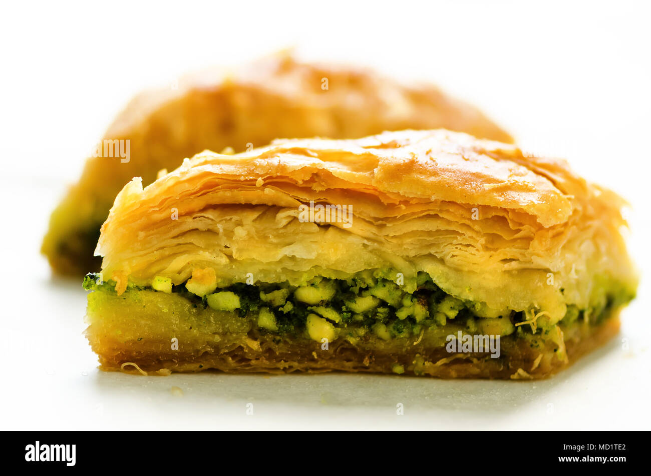 Baklava with pistachios, walnuts and honey on white background. Jewish ...