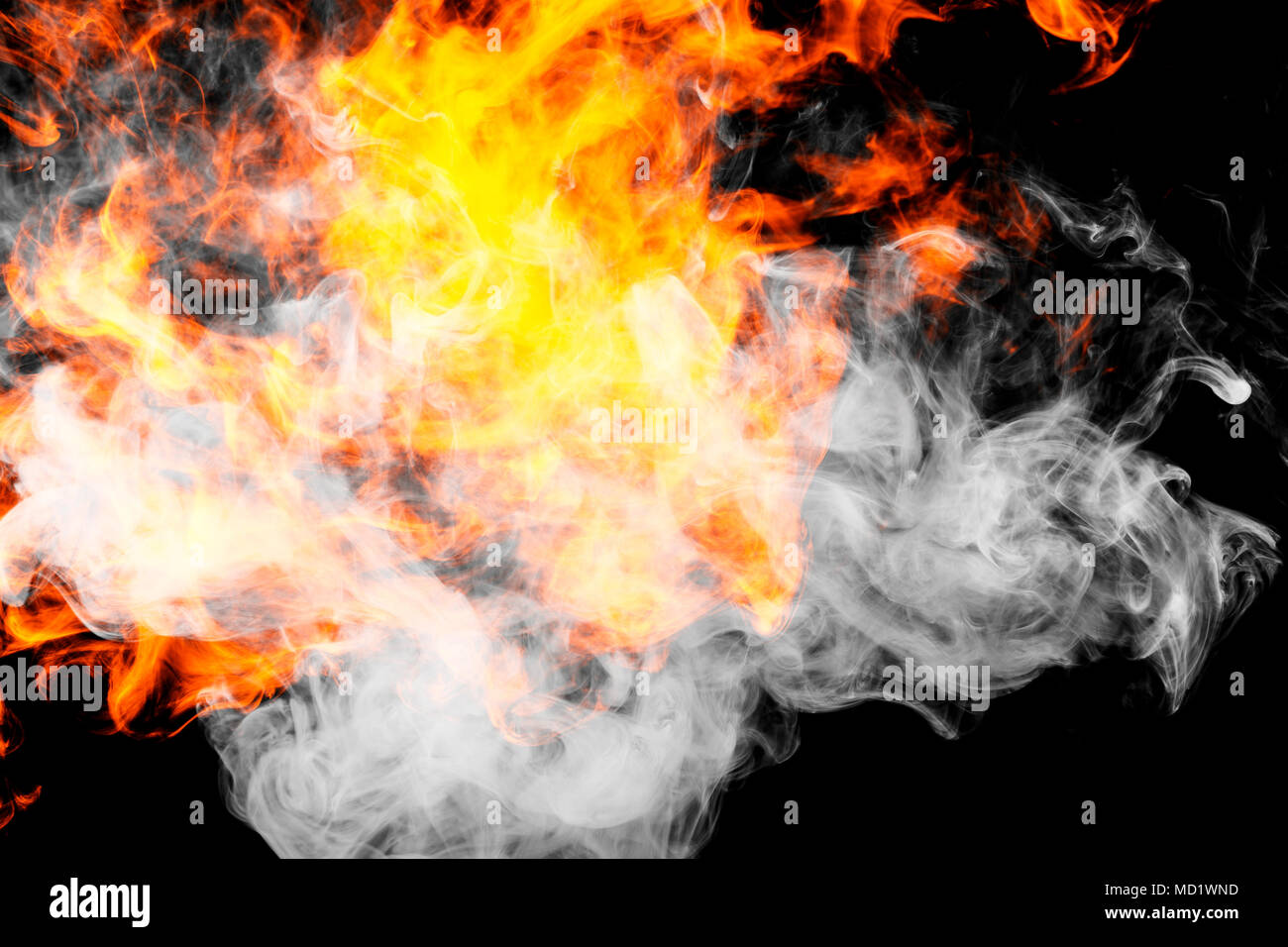 Dense fiery flames smoke on a black isolated background. Background of ...