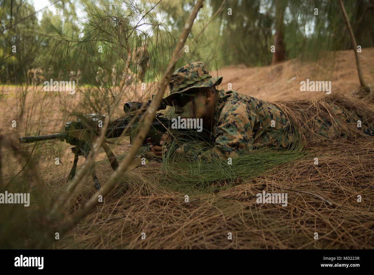 U.S. Marine Pfc. Francisco Perez sets up a security position using ...