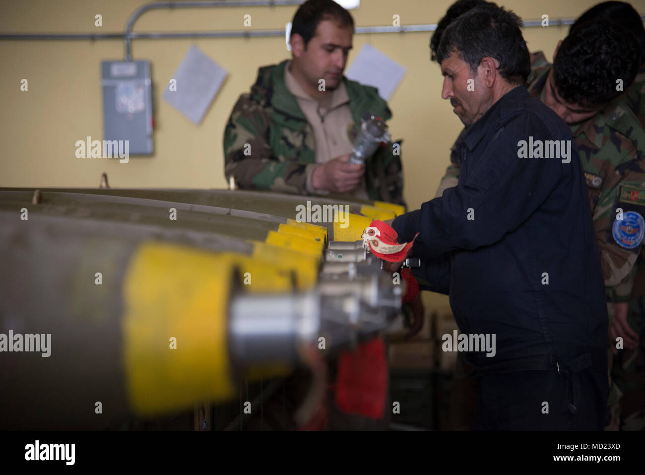 Mark-81 bombs are rolled down the line by Afghan Air Force maintainers ...