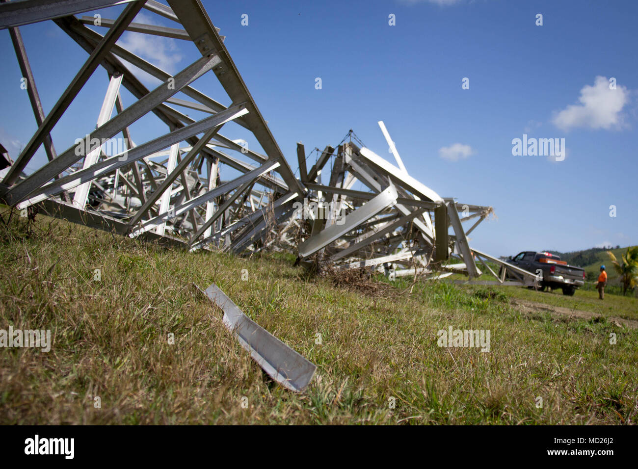 Storm-damaged lattice towers rest at the laydown yard while awaiting ...
