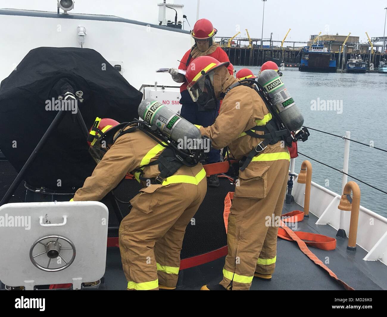 Coast Guard Cutter Naushon (WPB 1311) crew members conduct firefighting ...
