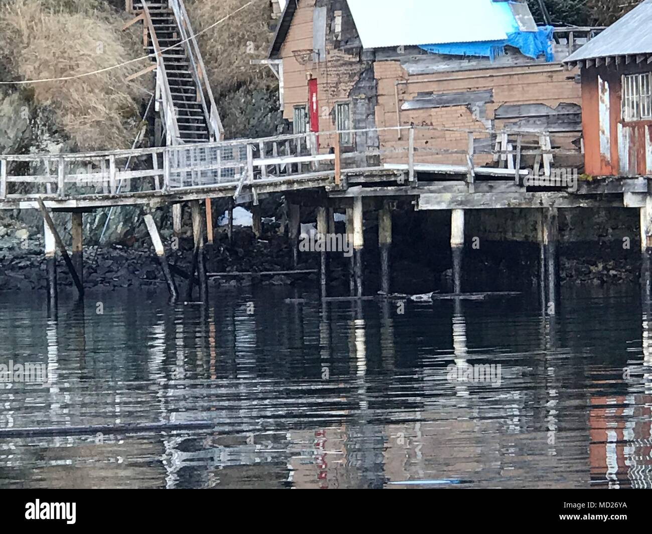 Under a Unified Command response, containment boom is placed around the ...