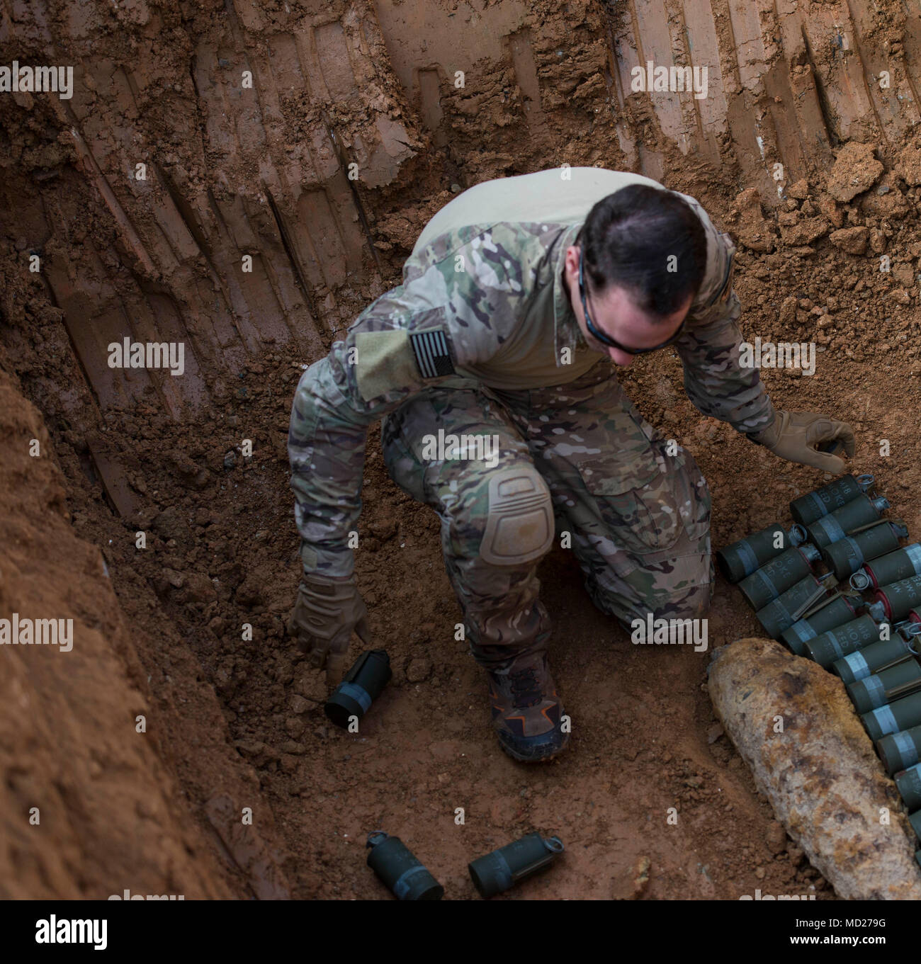An explosive ordnance disposal team member from the 18th Civil Engineer ...