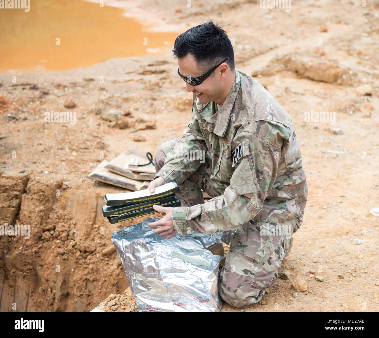 An 18th Civil Engineer Squadron explosive ordnance disposal team member ...