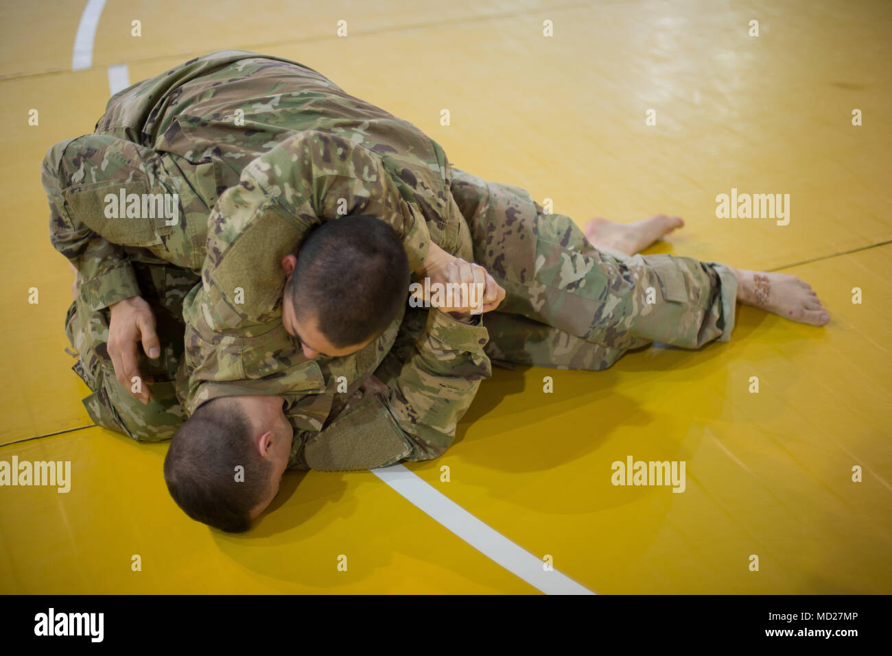 U.S. Army Sgt. Christopher Nathan escapes a headlock performed by Spc ...
