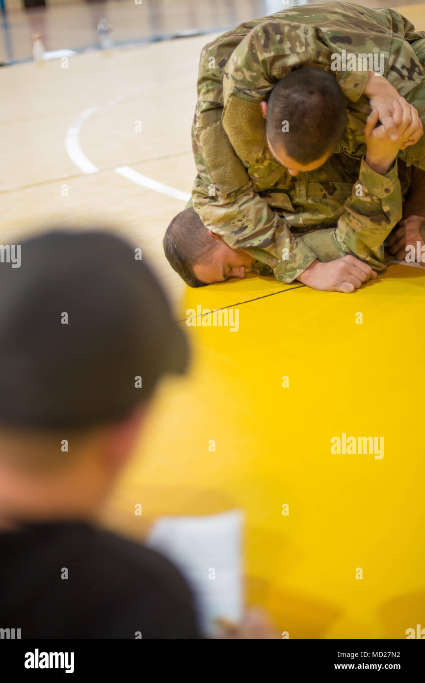 U.S. Army Sgt. Christopher Nathan and Spc. Jacob Ruth grapple during a ...