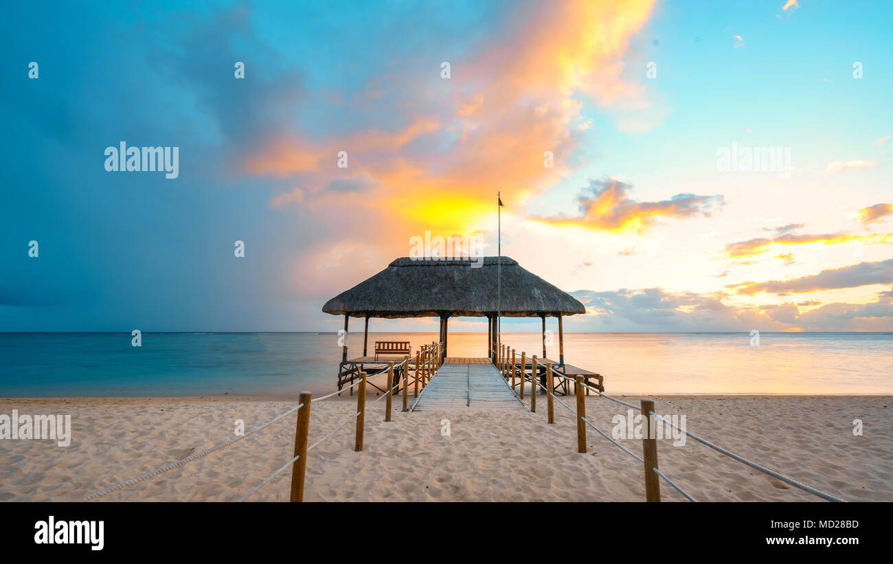 Amazing sunset in Mauritius Island (flic an flac beach) with Jetty ...