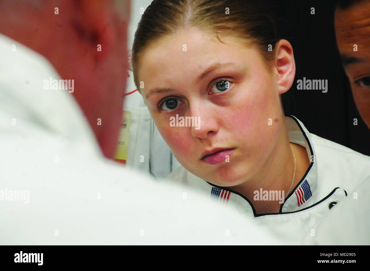 Spc. Katelyn Tran, Fort Carson, Colo., culinary team, listens to a ...