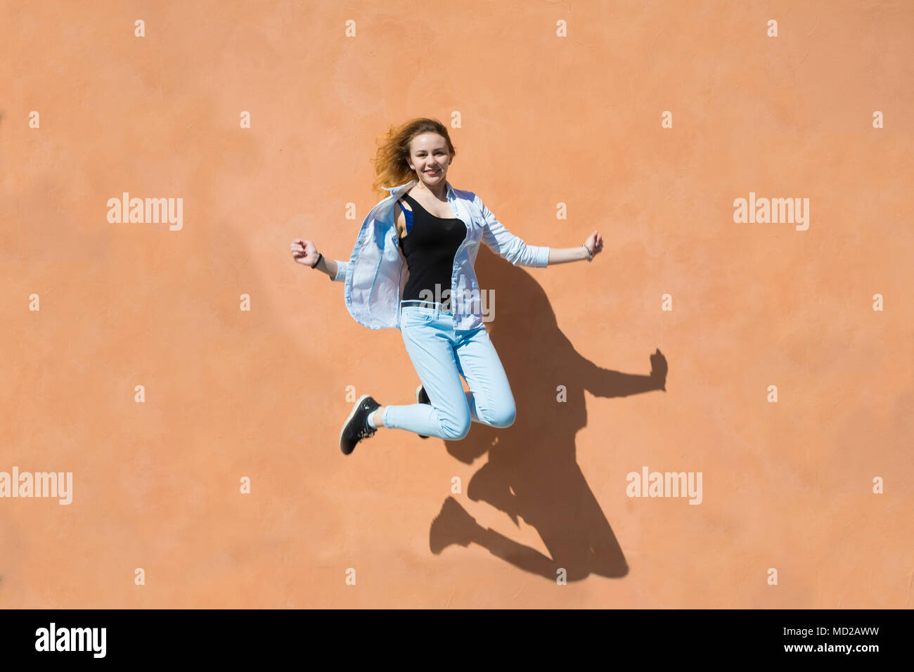 Lady jumping wall hi-res stock photography and images - Alamy