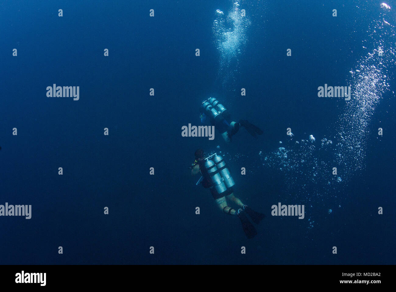 Navy Diver 3rd Class John Gerlicher, bottom, assigned to the Naval Base ...