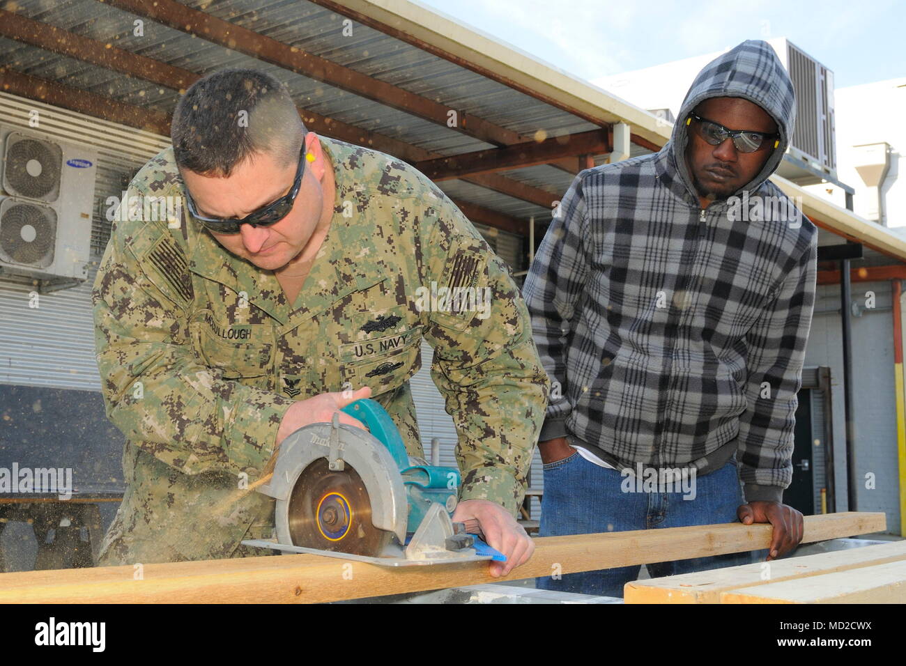 180313-N-GA223-1025 GULFPORT, Miss. (Mar. 13, 2018) - Sawdust flies ...