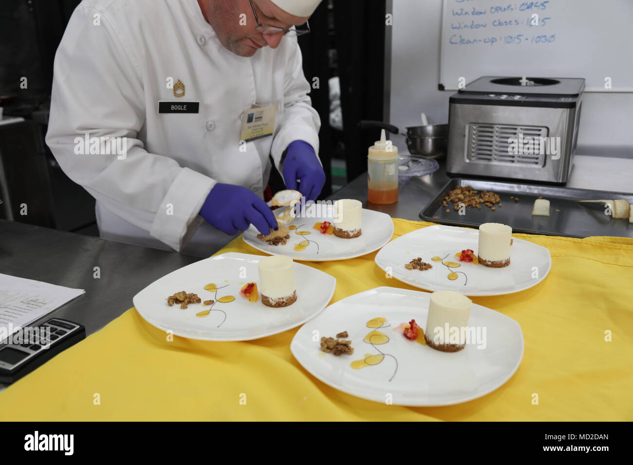 Sgt. 1st Class Michael Bogle adds ice cream quenelles to his plated ...