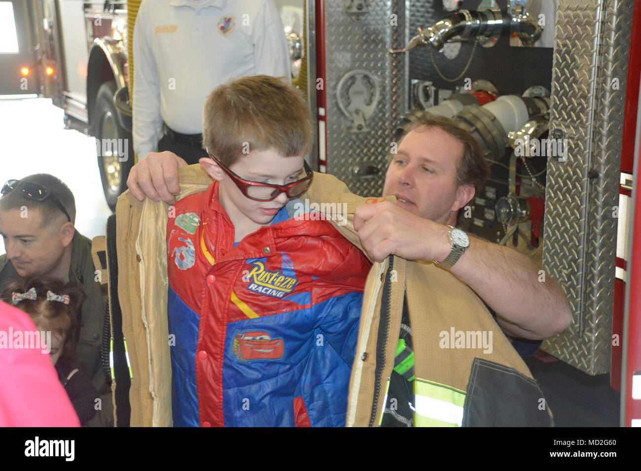 Fort Lee Firefighter Jim Hazlitt helps Patrick Staton, a student from ...