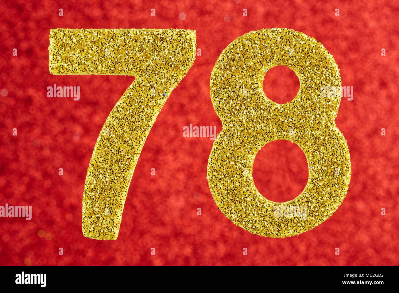 Number seventy-eight golden color over a red background. Anniversary ...