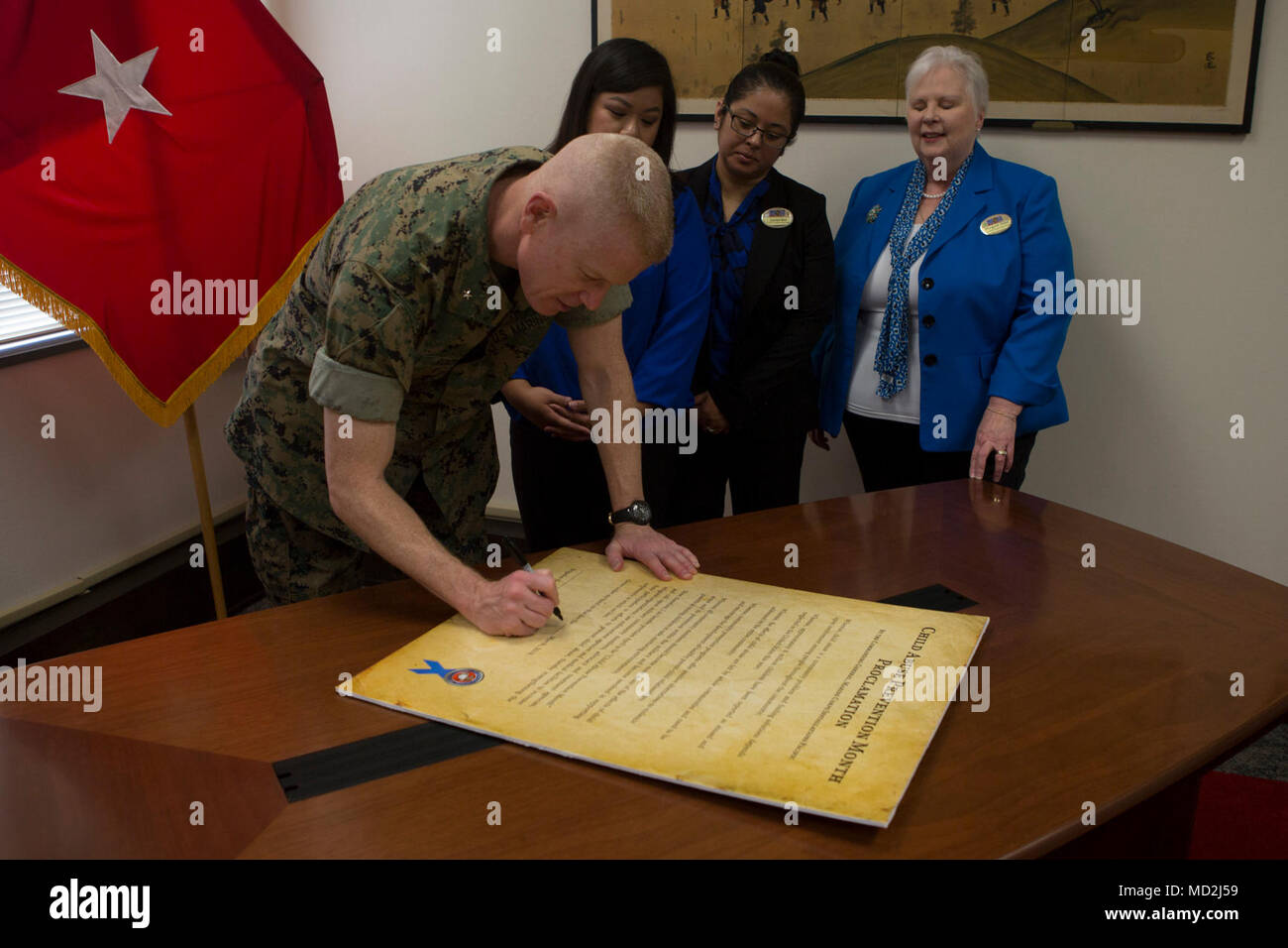 CAMP FOSTER, OKINAWA, Japan – Brig. Gen. Paul Rock Jr. signs the Child ...