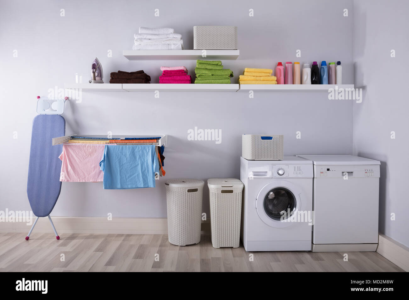 Interior Of Utility Room With Washing Machine And Drying Clothes Stock ...