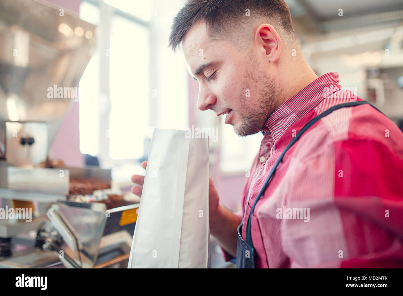 Man sniffing hi-res stock photography and images - Alamy