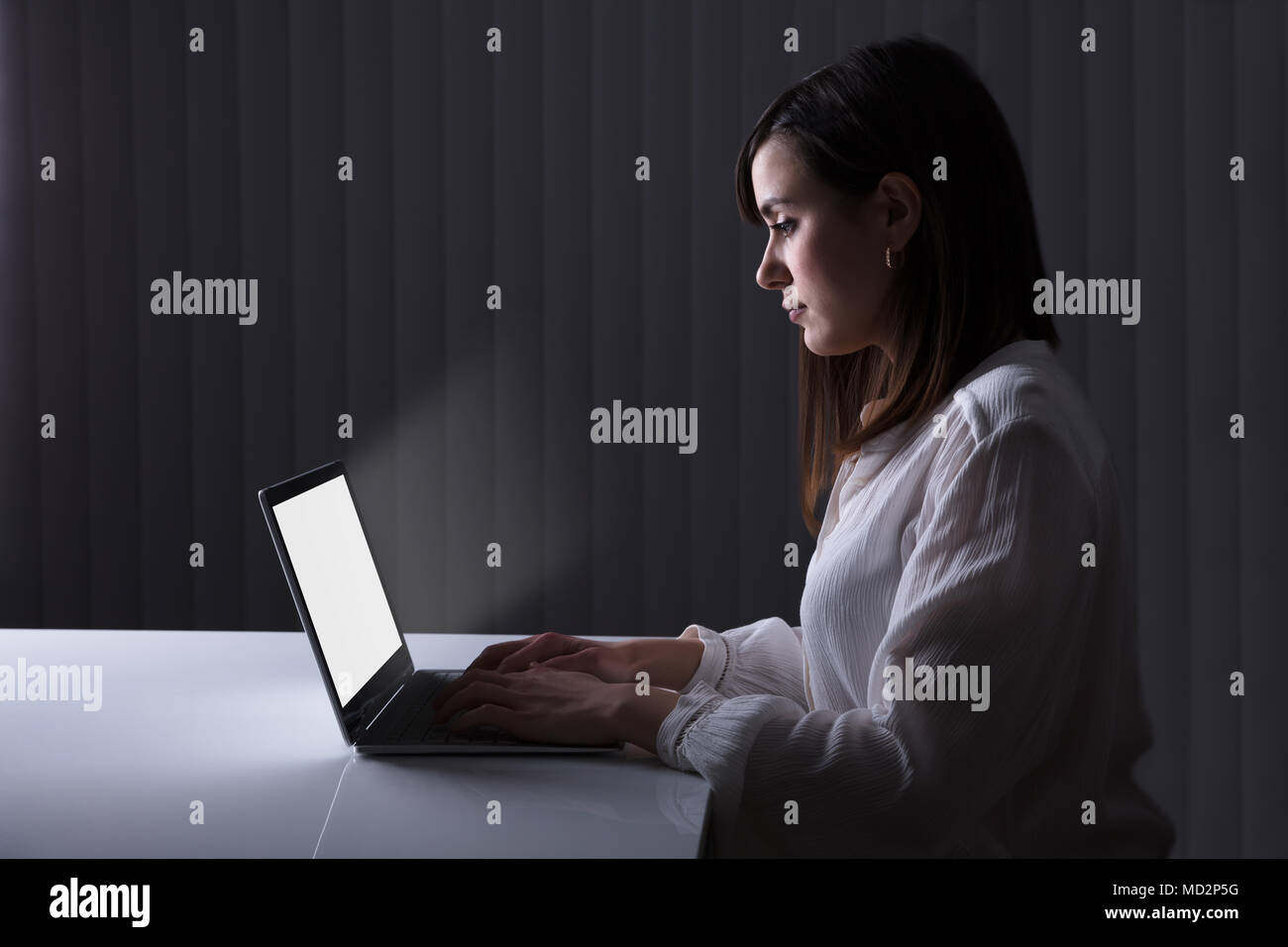 Woman looking screen laptop night hi-res stock photography and images ...