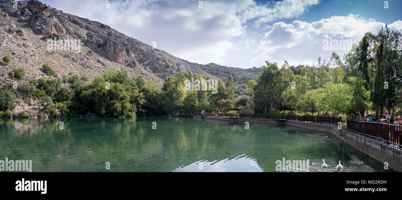 Scenic view of pond and lake against cloudy sky, Crete, Greece Stock ...