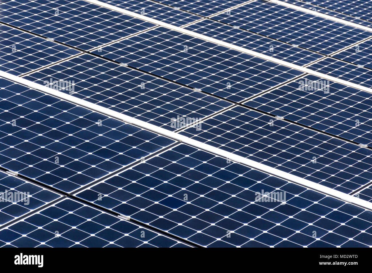 Blue rotating solar panels tilted axis tracker, future energy concept ...