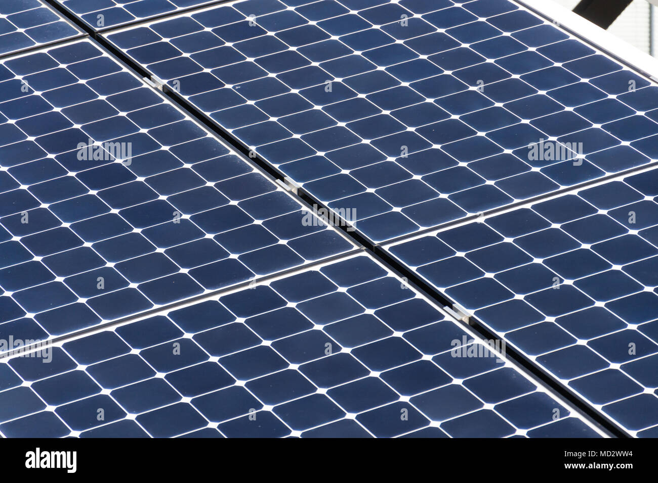 Blue rotating solar panels tilted axis tracker, future energy concept ...