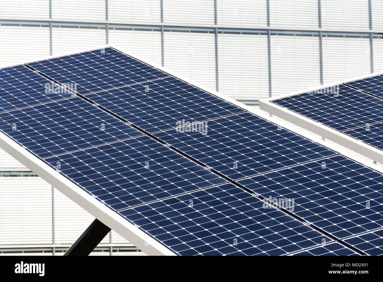 Blue rotating solar panels tilted axis tracker, future energy concept ...