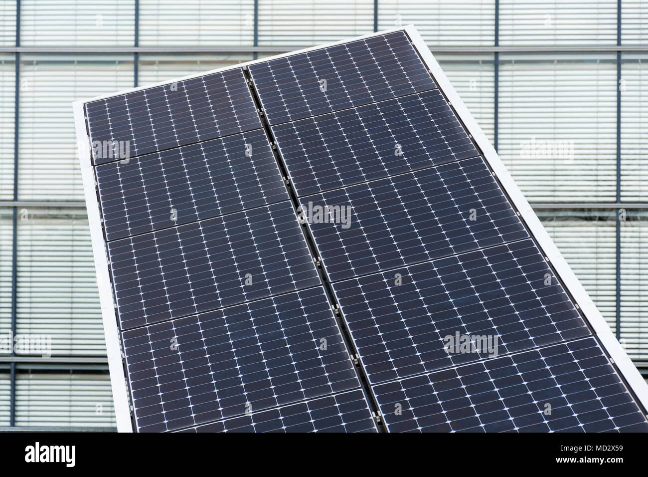 Blue rotating solar panels tilted axis tracker, future energy concept ...