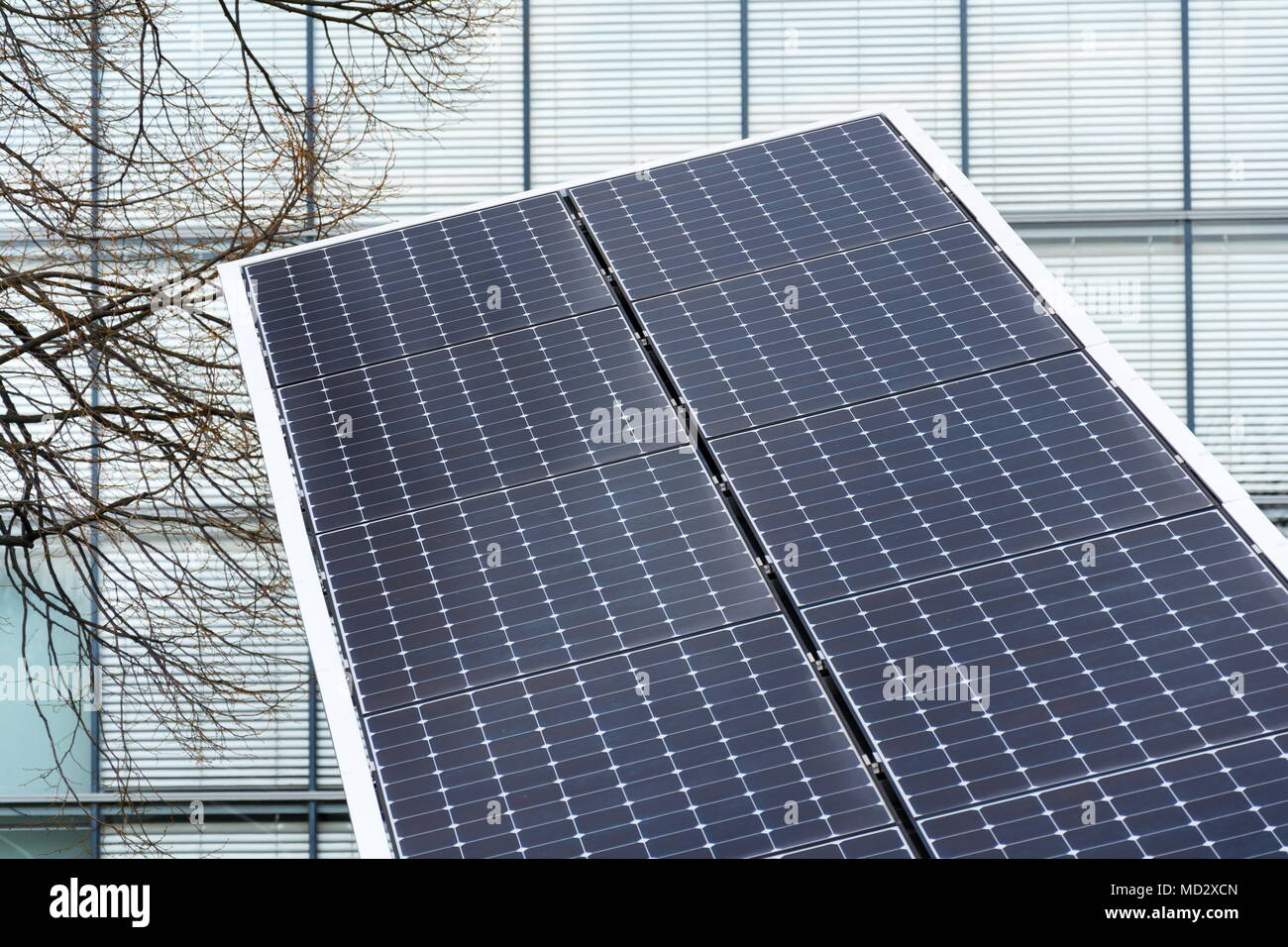 Blue rotating solar panels tilted axis tracker, future energy concept ...