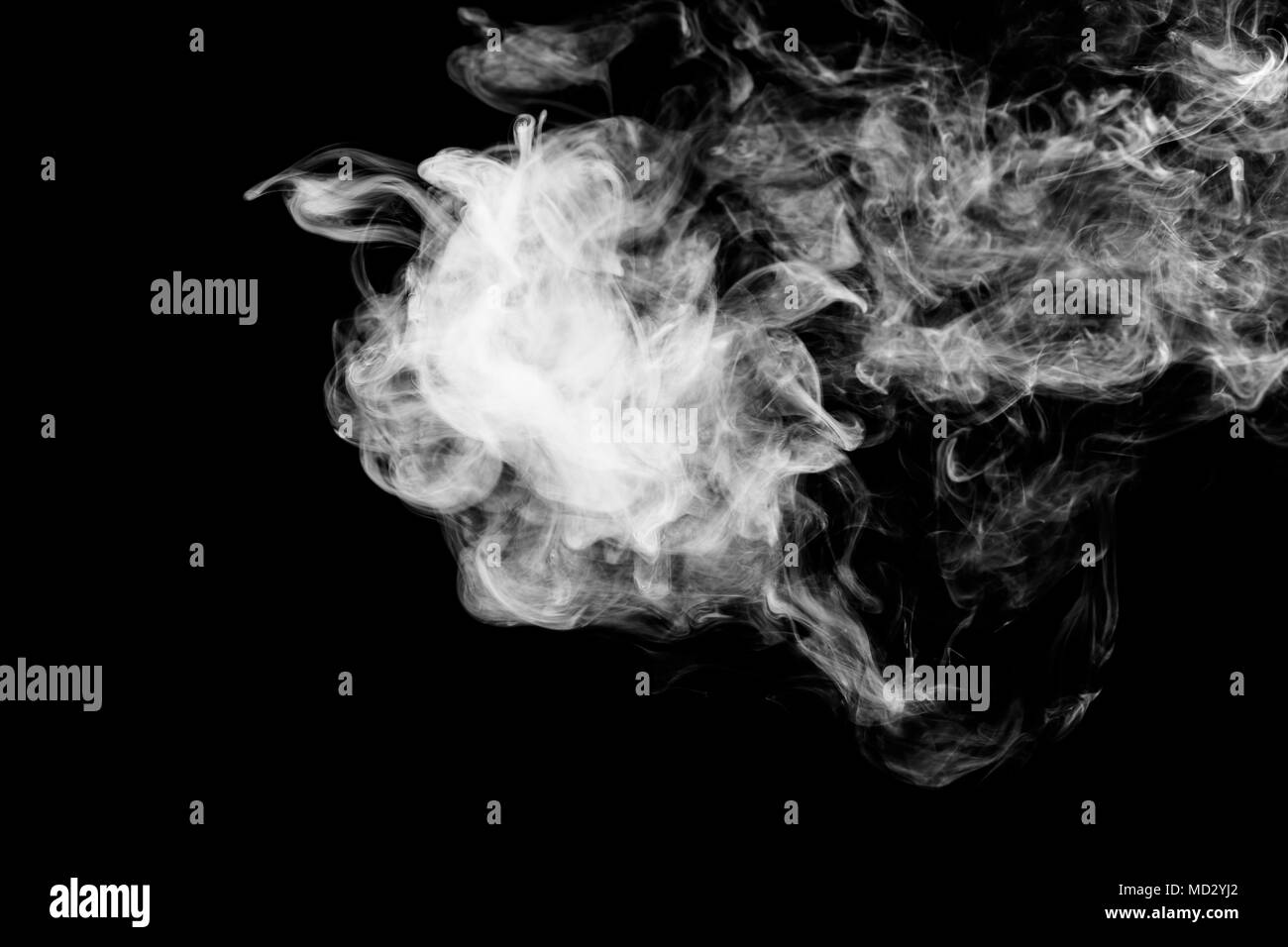 Thick white smoke on a black isolated background. Background from the ...