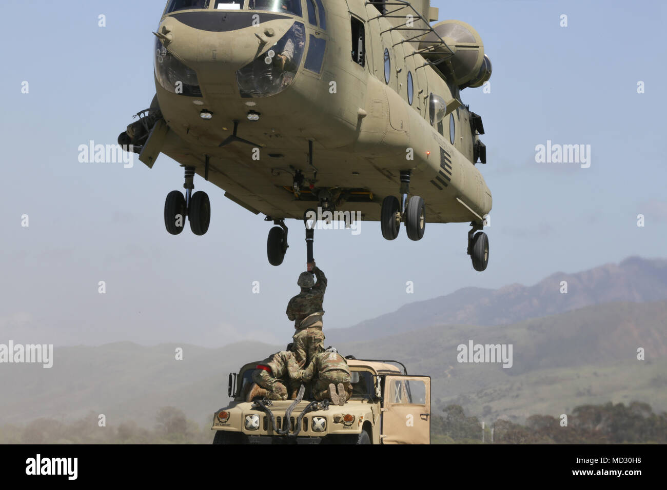 U.S Army Soldiers, assigned to 20th CBRN, connect the Humvee to the ...